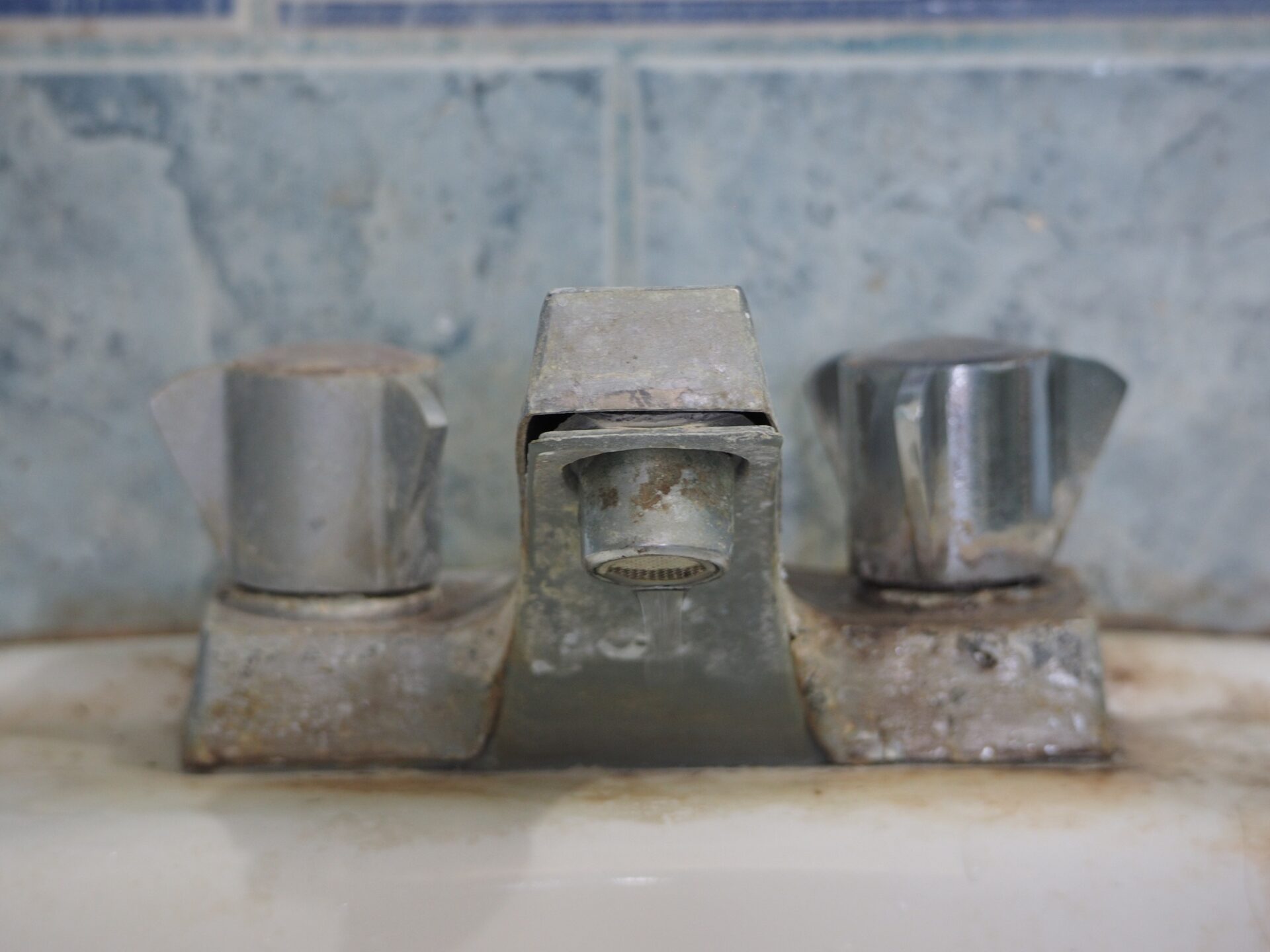 How Can I Reduce Scale Buildup In My Shower And Sinks? | Code Blue Plumbing
